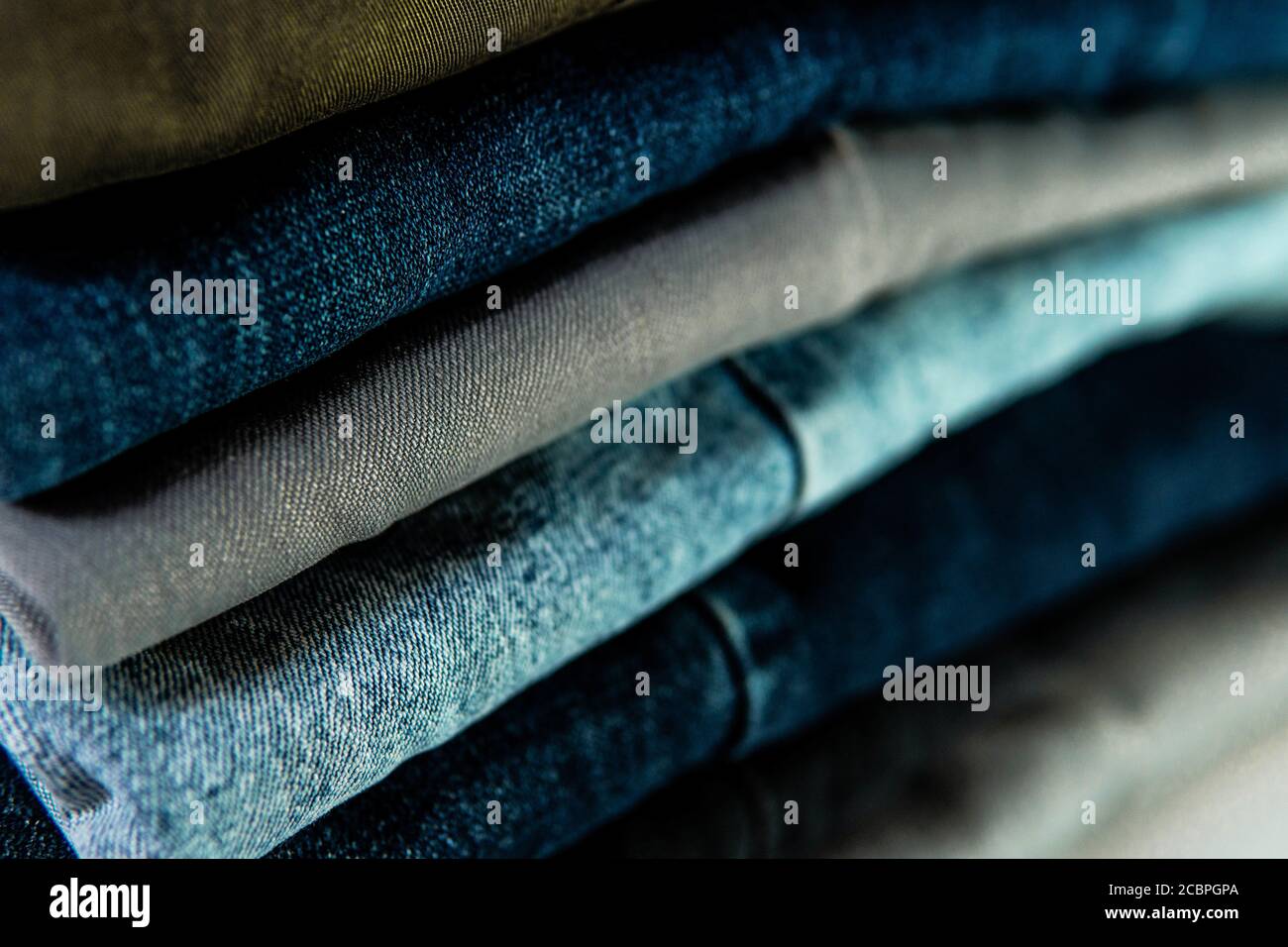 Stack of neatly folded jeans Stock Photo - Alamy