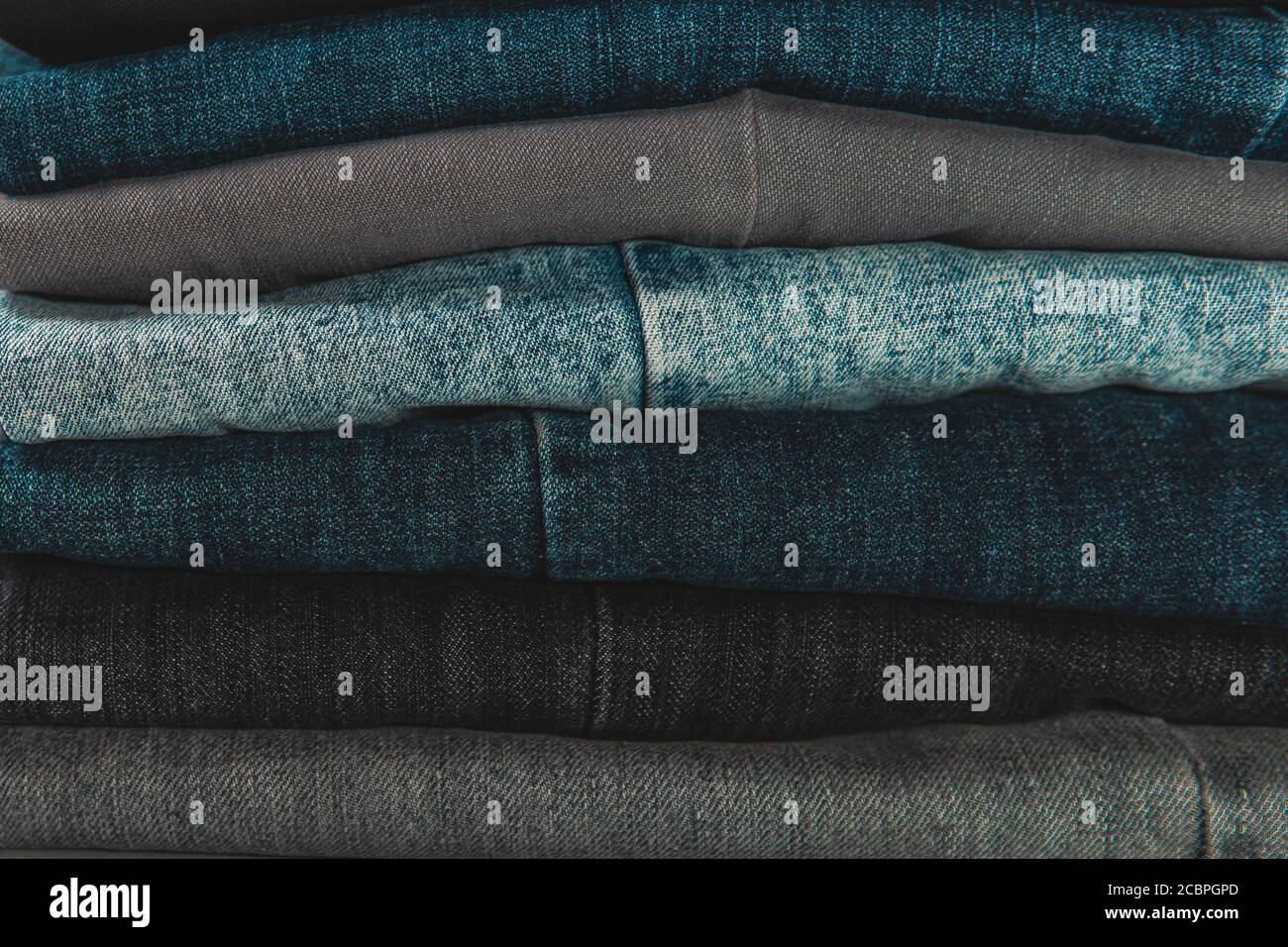 Stack of neatly folded jeans Stock Photo - Alamy