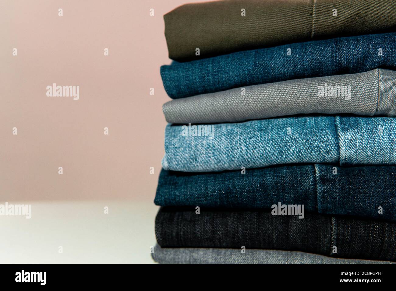Stack of neatly folded jeans Stock Photo - Alamy