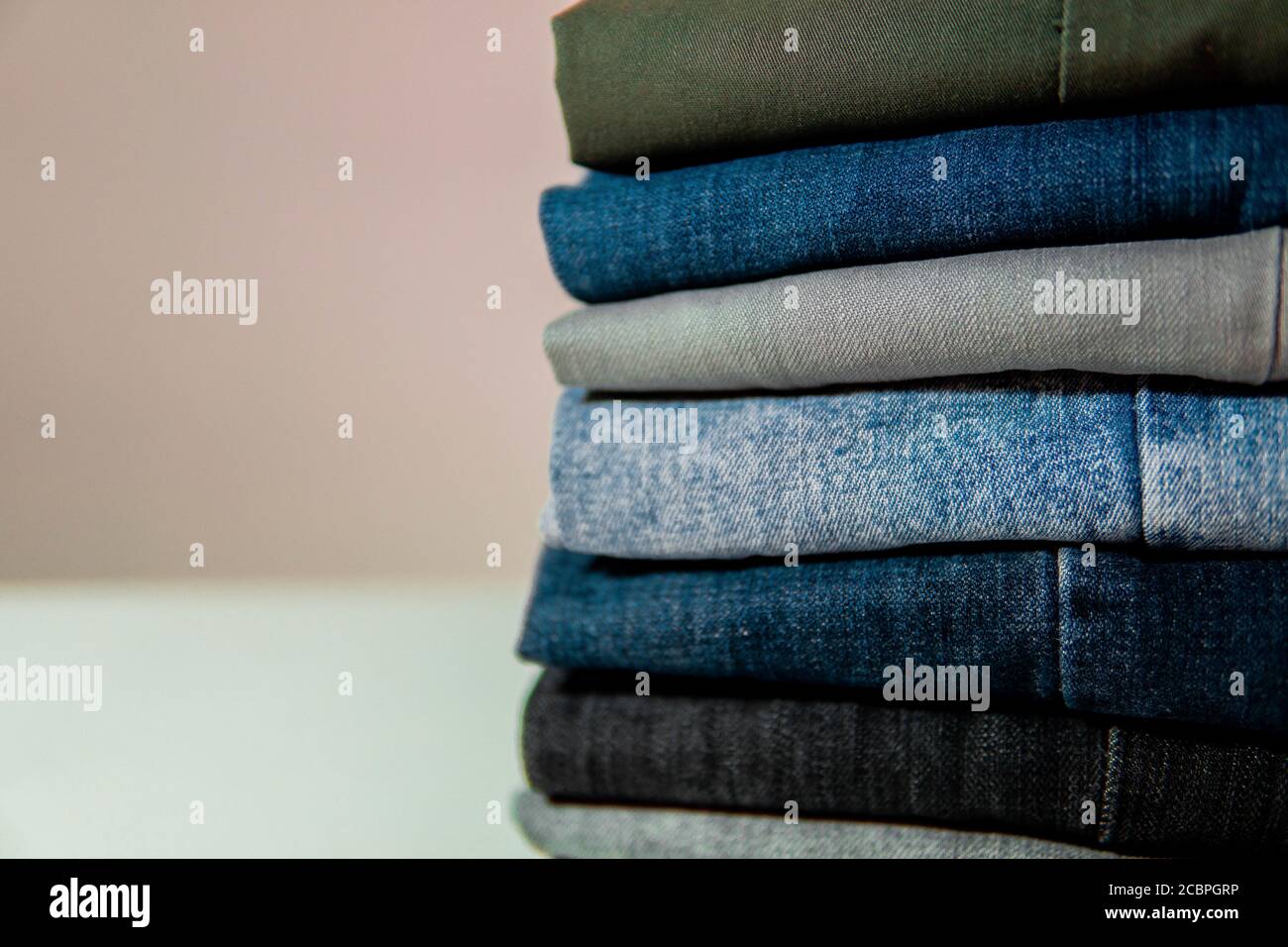Stack of neatly folded jeans Stock Photo - Alamy