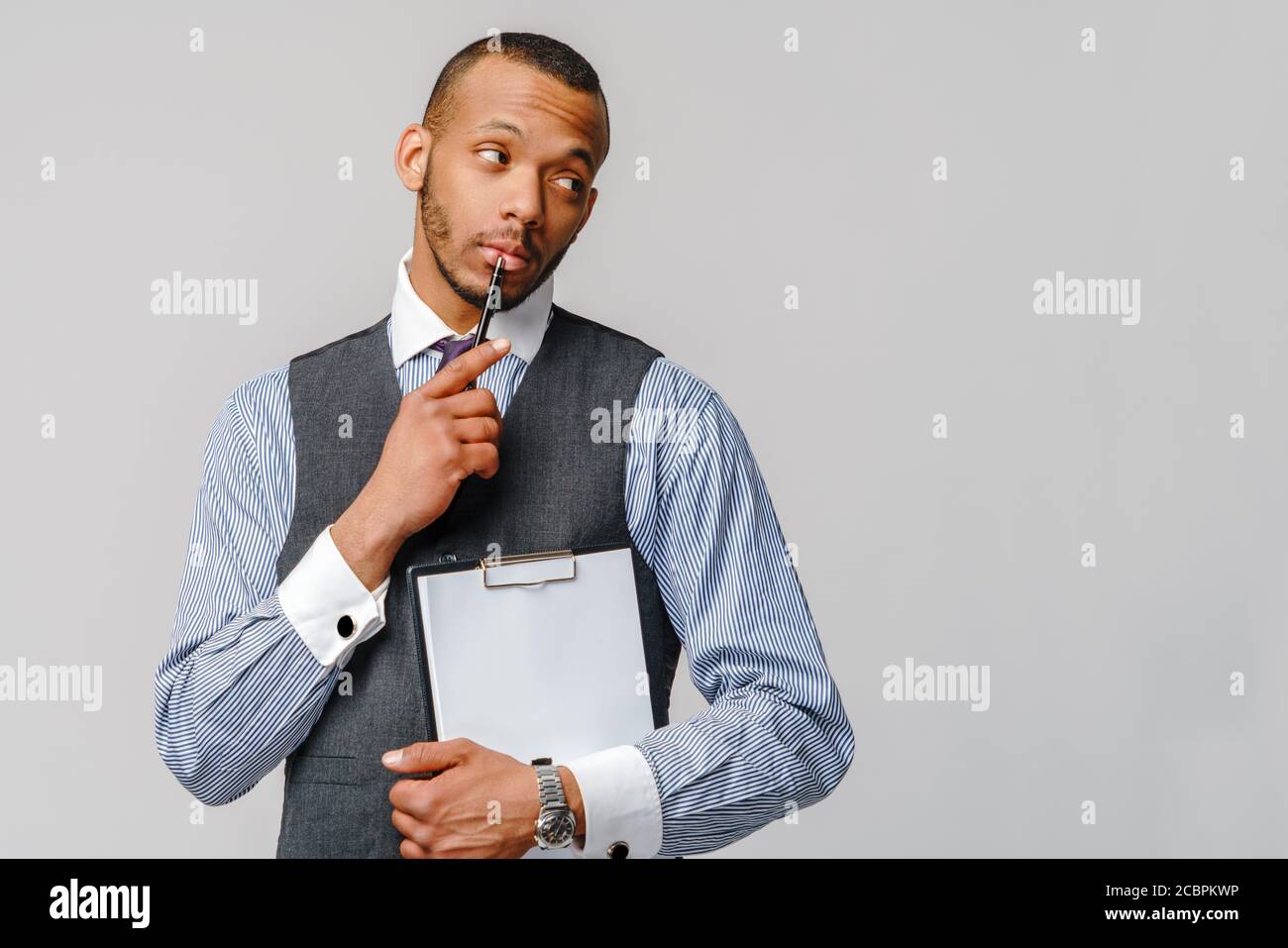a young african american man holding plain table tablet and pen Stock ...