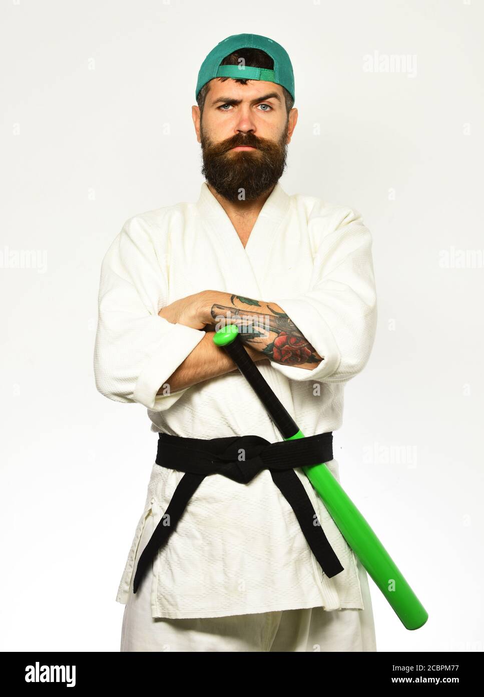 Violence and bullying concept. Man with beard in white kimono and green ...