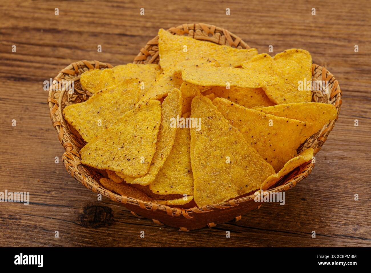 Mexican crunchy corn nachos triangle heap Stock Photo - Alamy
