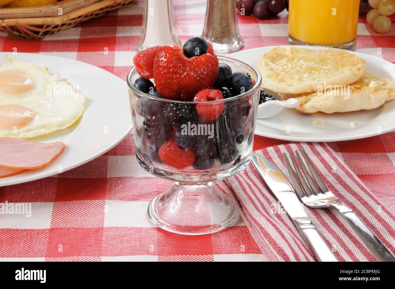 A cup of fruit cocktail with ham and eggs Stock Photo - Alamy