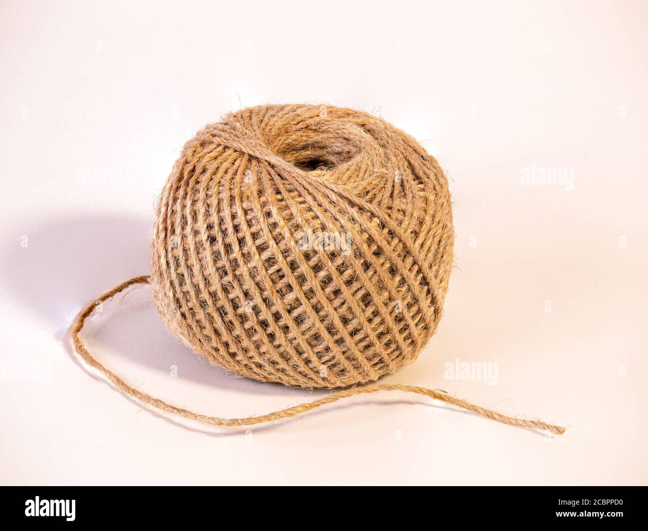 Uncoiled ball of string isolated on white background Stock Photo - Alamy