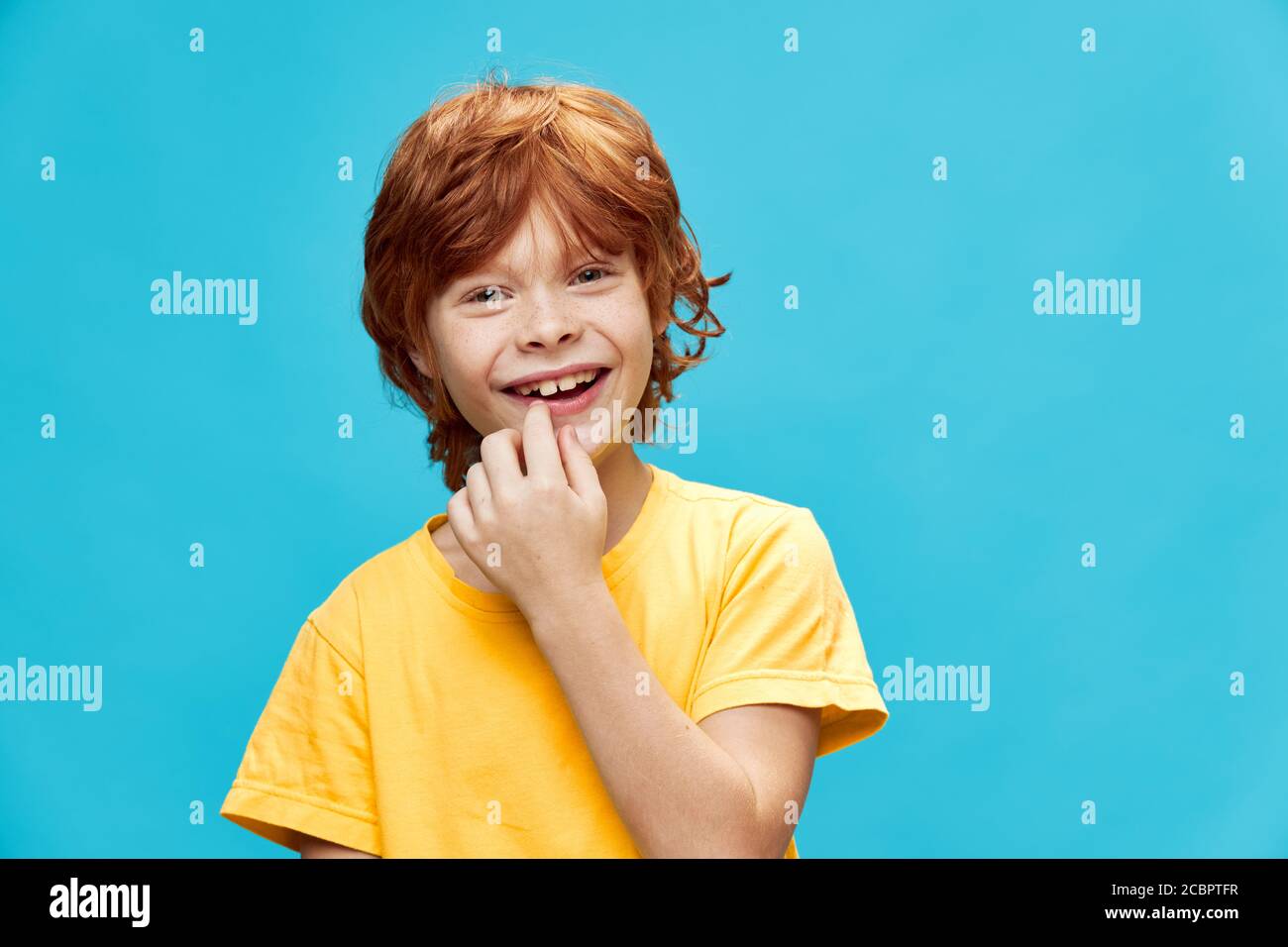 energetic red hair child laughing on isolated background Stock Photo ...