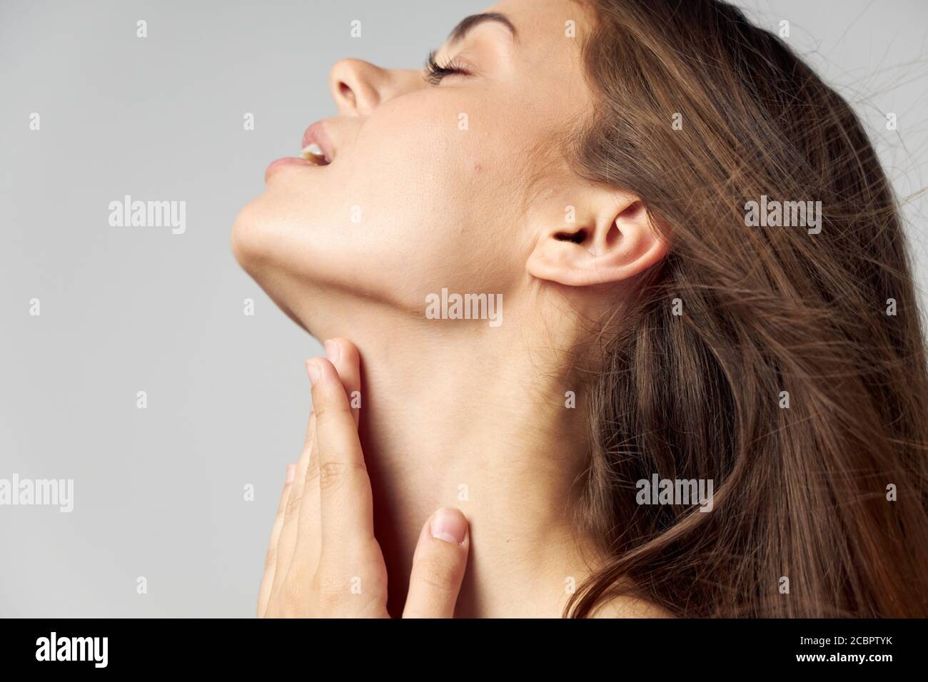 Hand near neck hi-res stock photography and images - Alamy