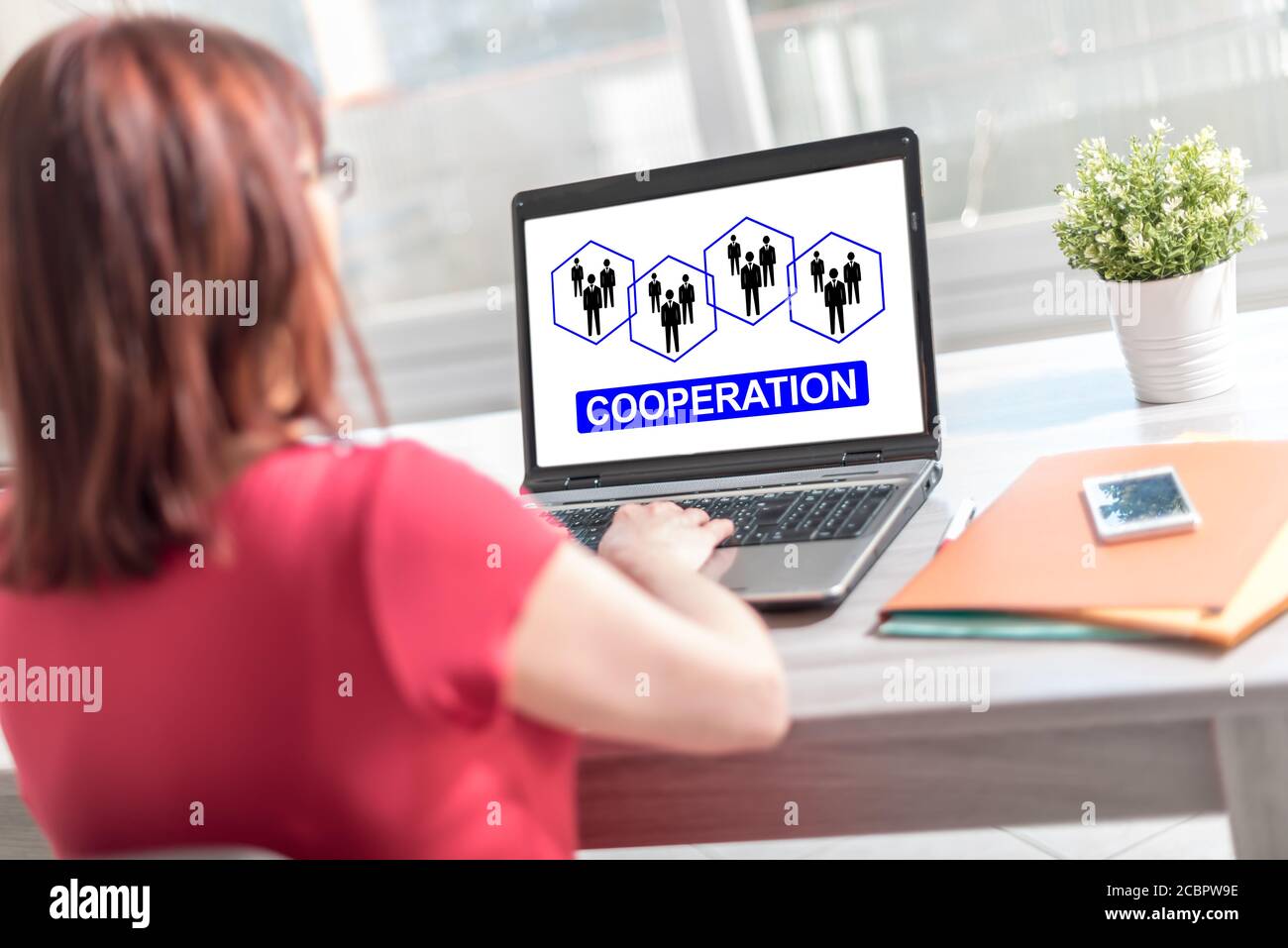 Laptop screen displaying a cooperation concept Stock Photo - Alamy