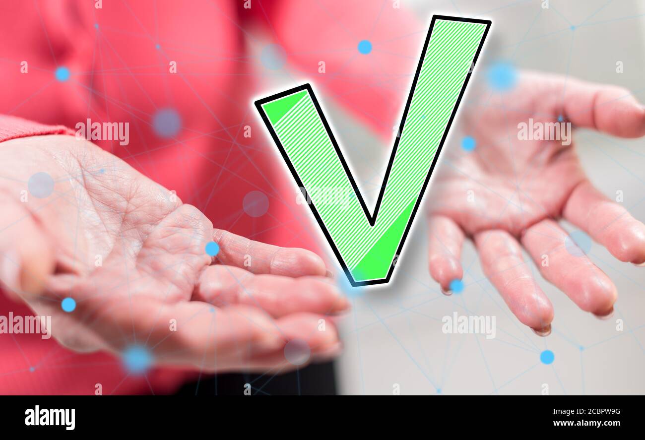 Validation concept above the hands of a woman in background Stock Photo ...