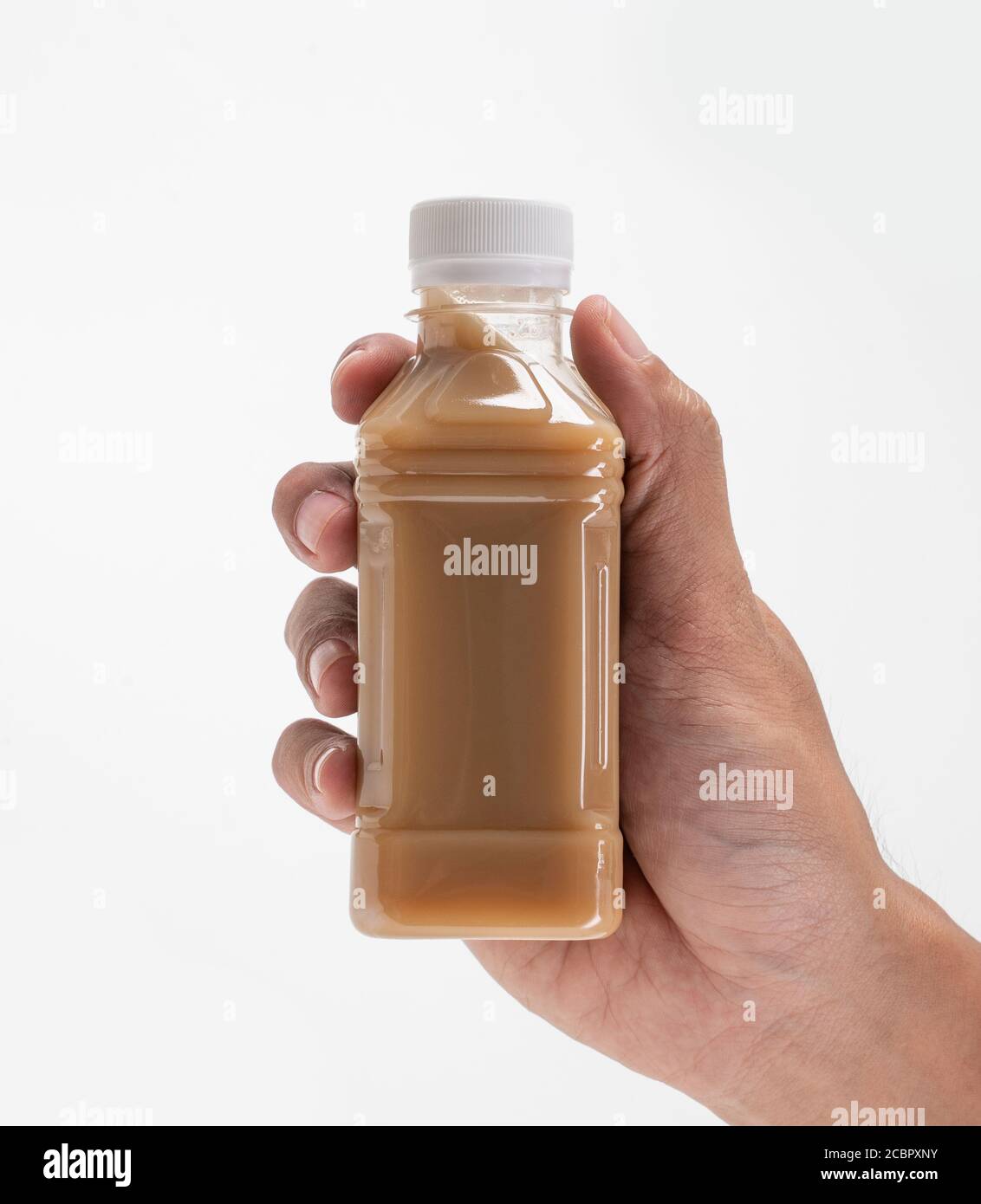 gesture of hand holding plastic bottle product mockup. liquid bevarage ...
