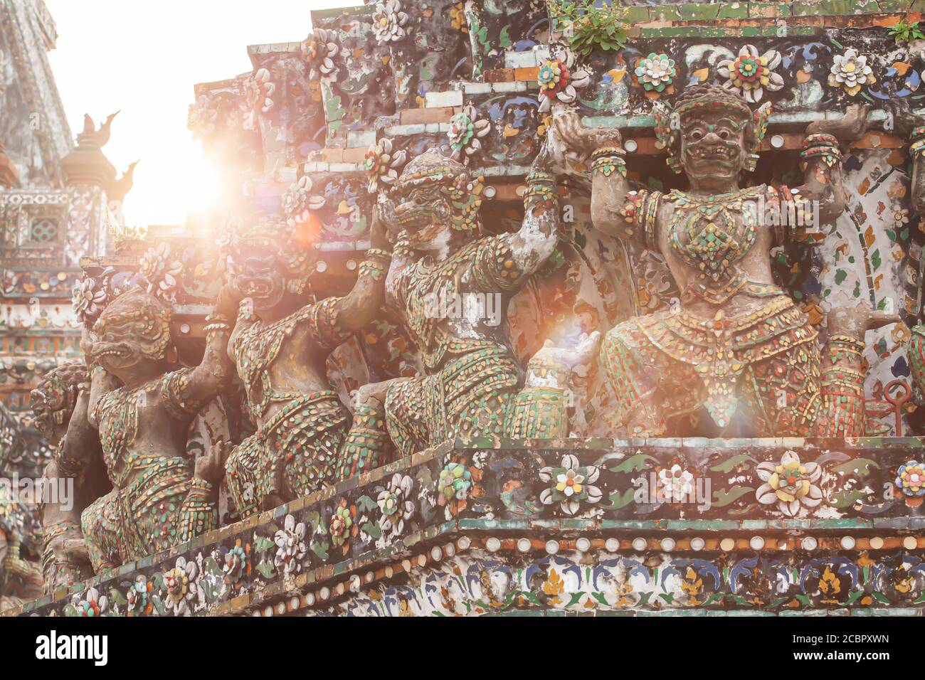 Picturesque giant guardian statues with ceramic mosaic tiles decorated ...