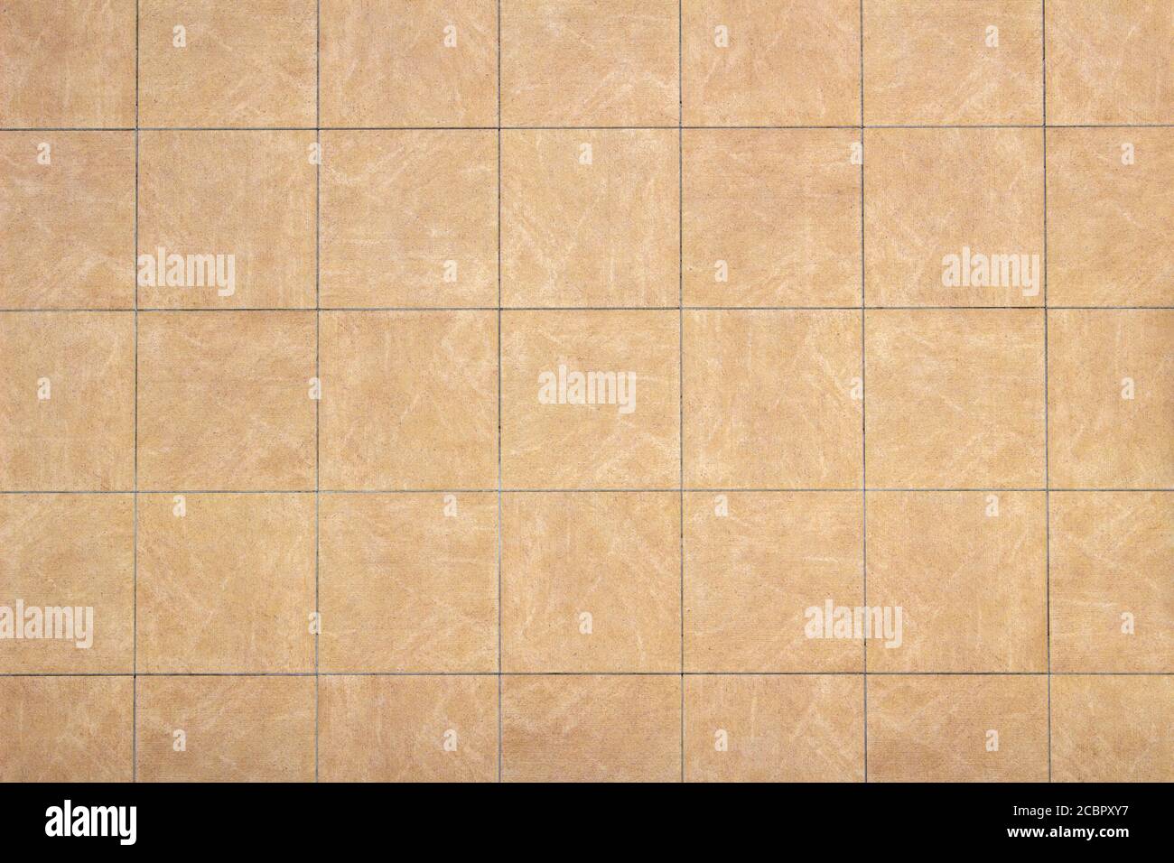 Photo of a wall covered with khaki tiles as background material Stock ...