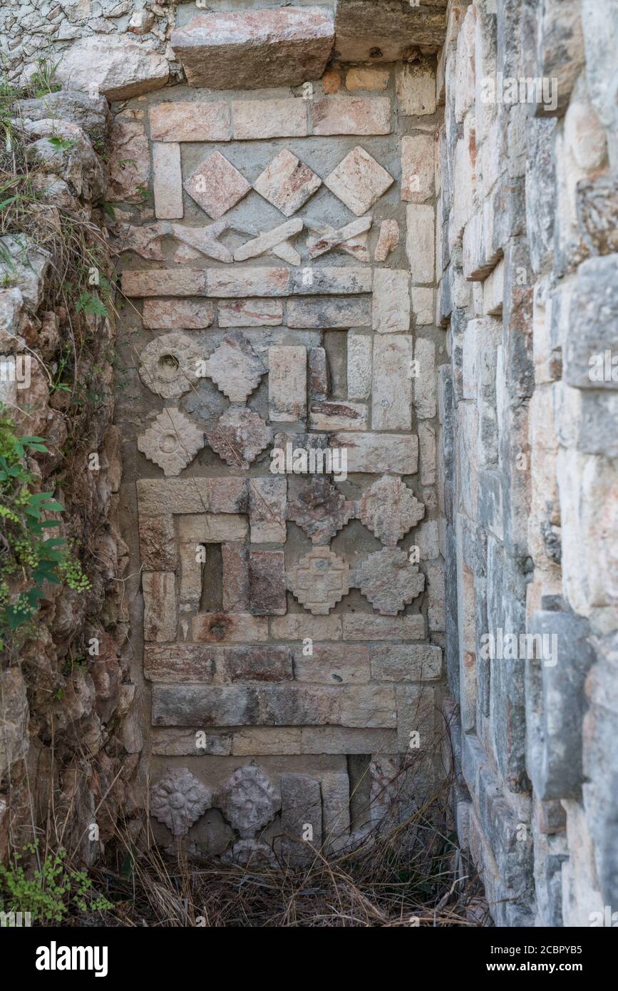 Decorative stone carvings in the Puuc style on the Temple of the Macaw ...
