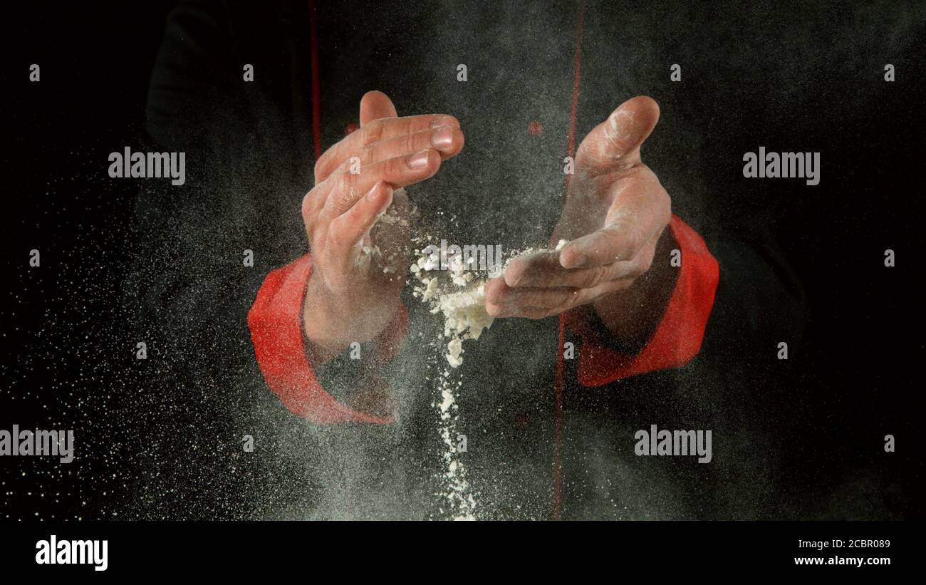 Freeze motion of cooker with clapping hands with flour. Food ...