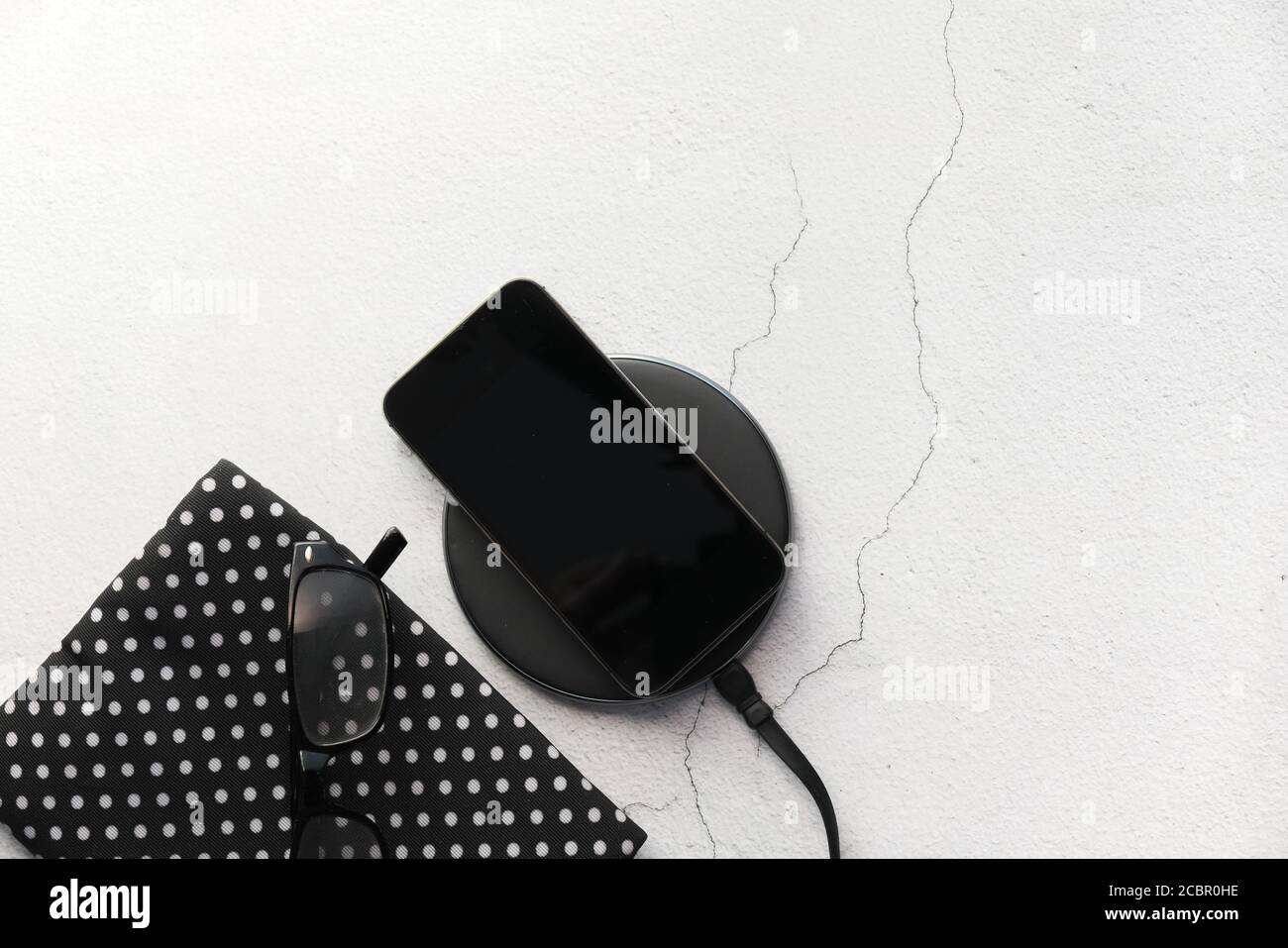 charging Smartphone Using Wireless Charging Pad, top view Stock Photo ...