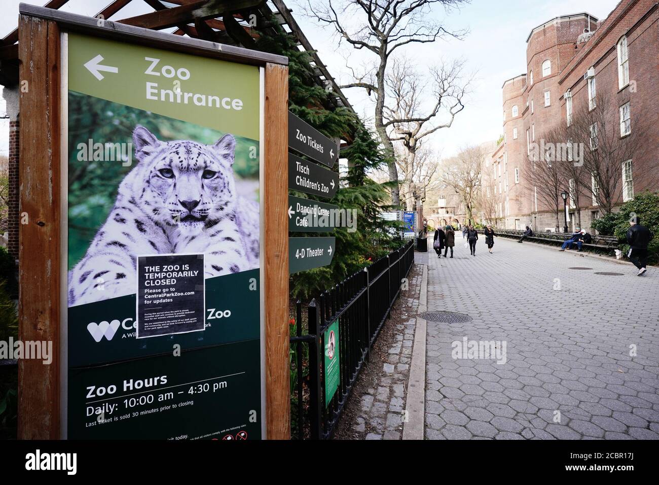 A sign post outside the Central Park Zoo informing people of the ...
