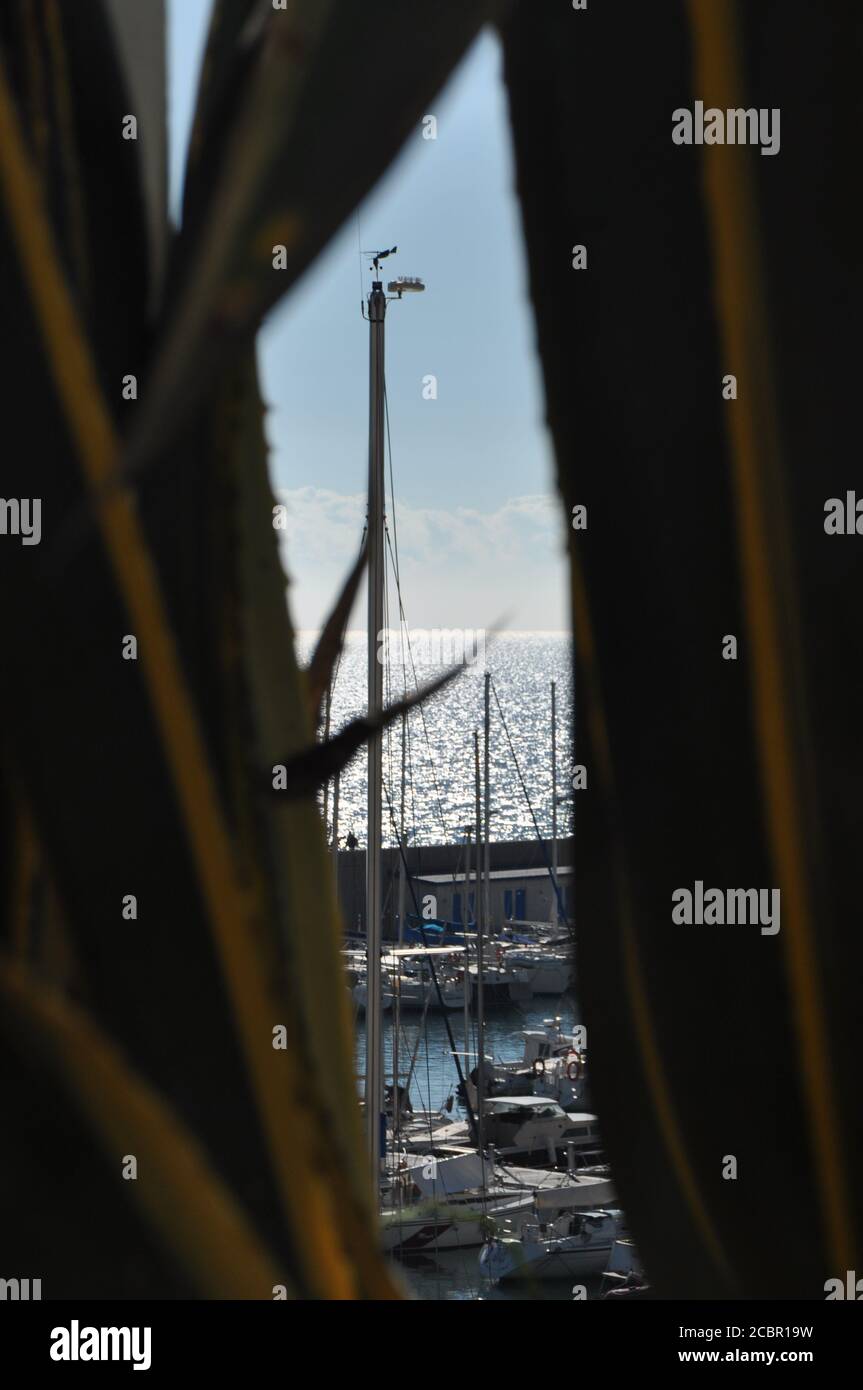 Sunny scenery of a beautiful coastal harbor with lots of boats Stock ...