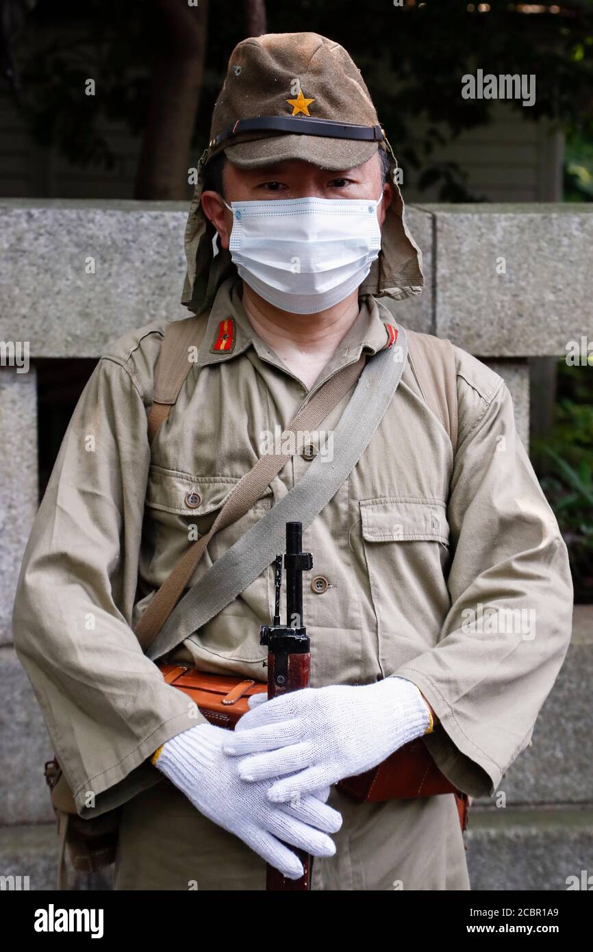 Tokyo, Japan. 15th Aug, 2020. A man dressed as a Japanese imperial army ...