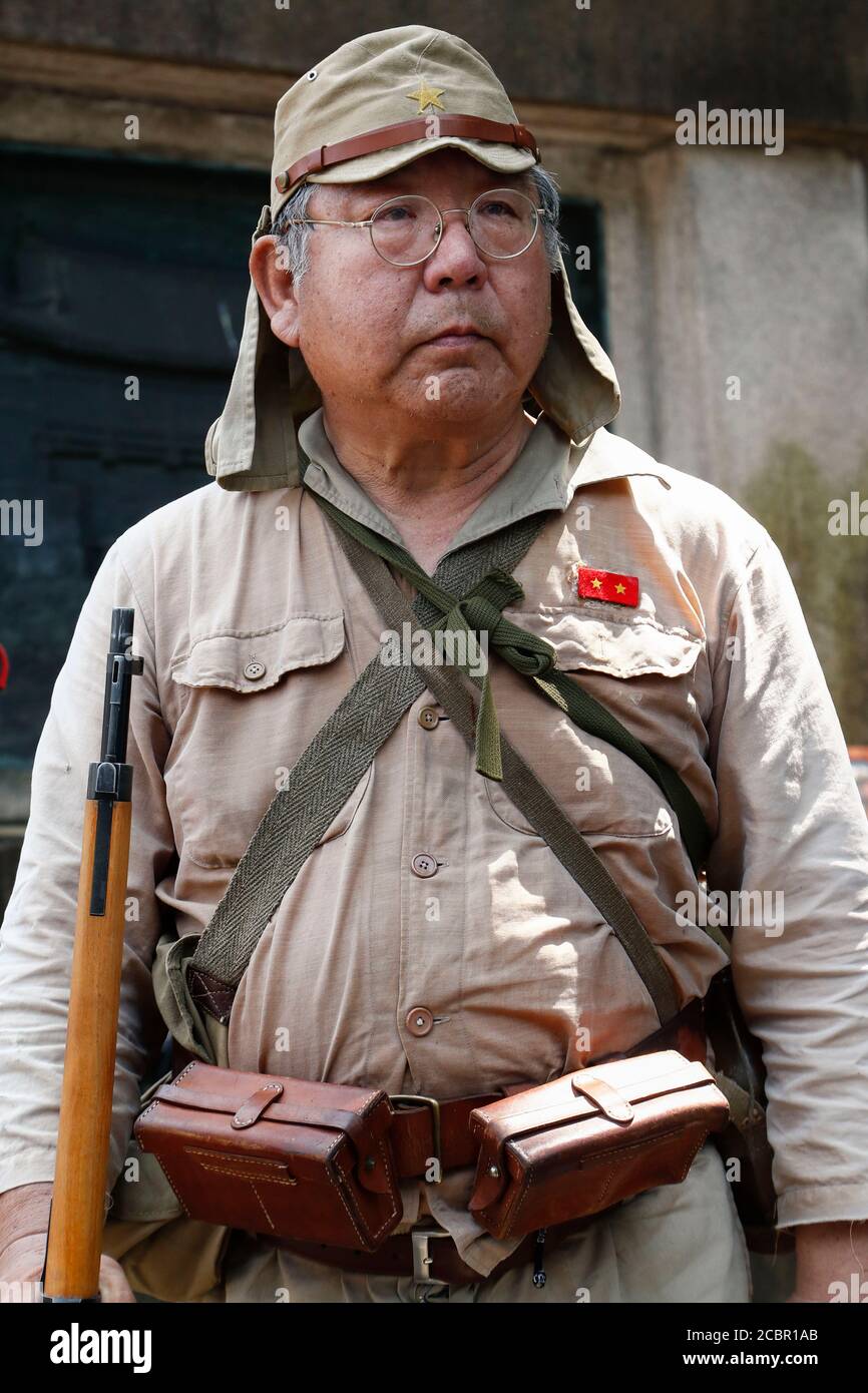 Tokyo, Japan. 15th Aug, 2020. A man dressed as a Japanese imperial army ...