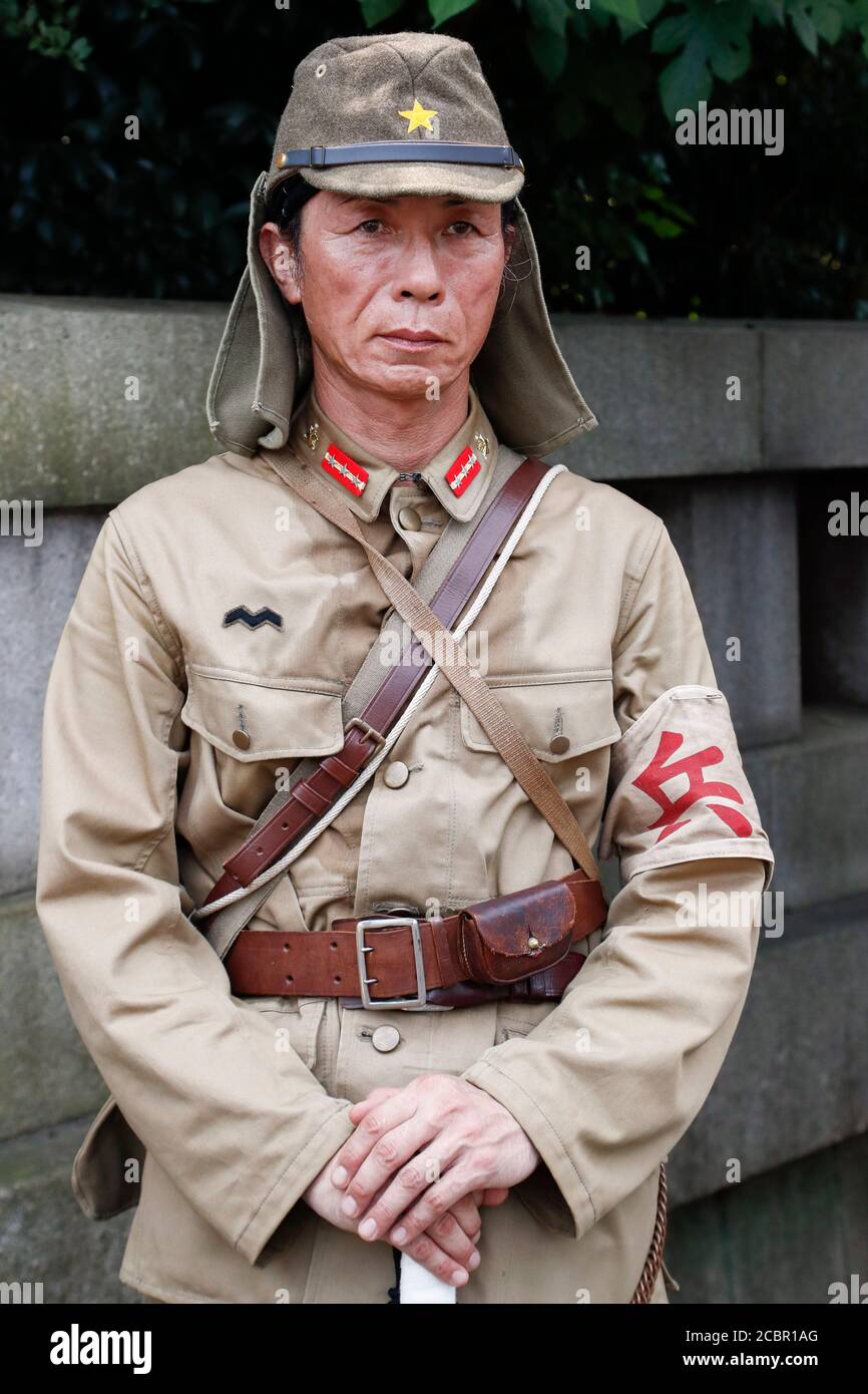 Tokyo, Japan. 15th Aug, 2020. A man dressed as a Japanese imperial army ...
