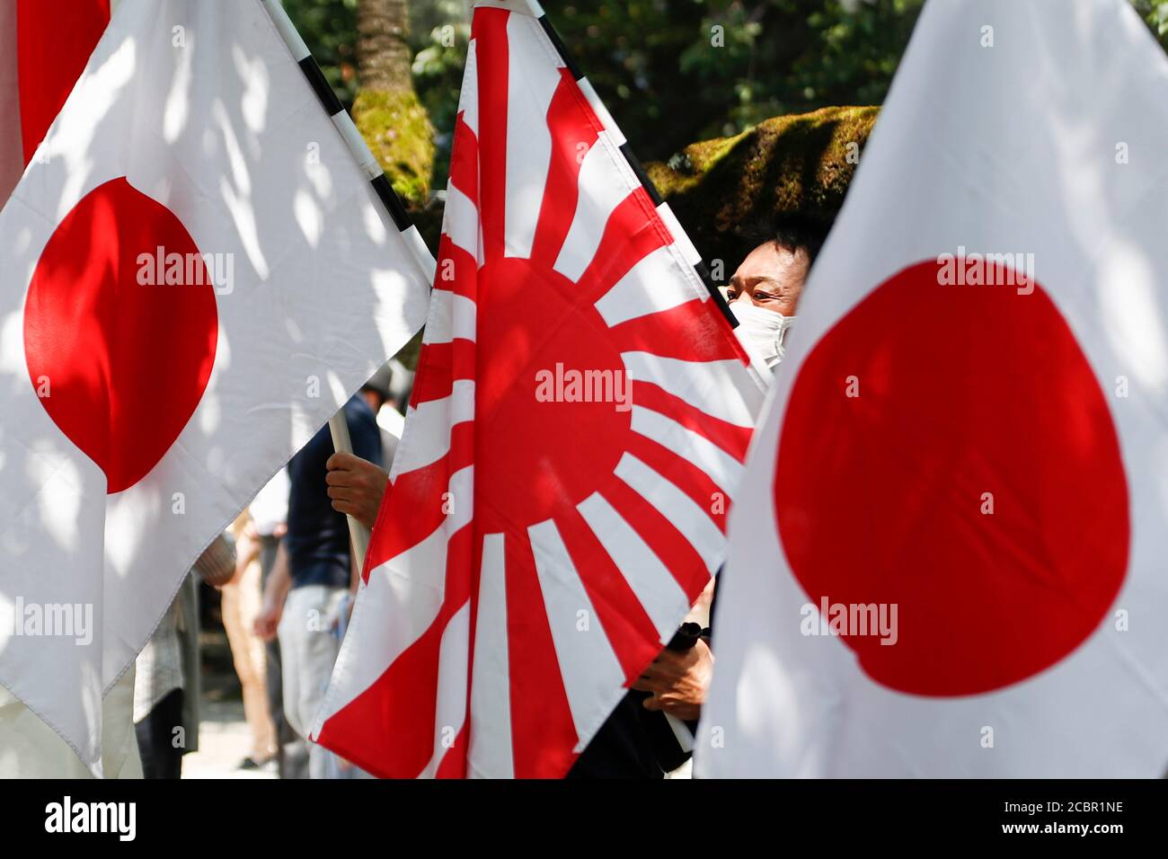 Tokyo, Japan. 15th Aug, 2020. Japanese nationalists wearing face masks ...