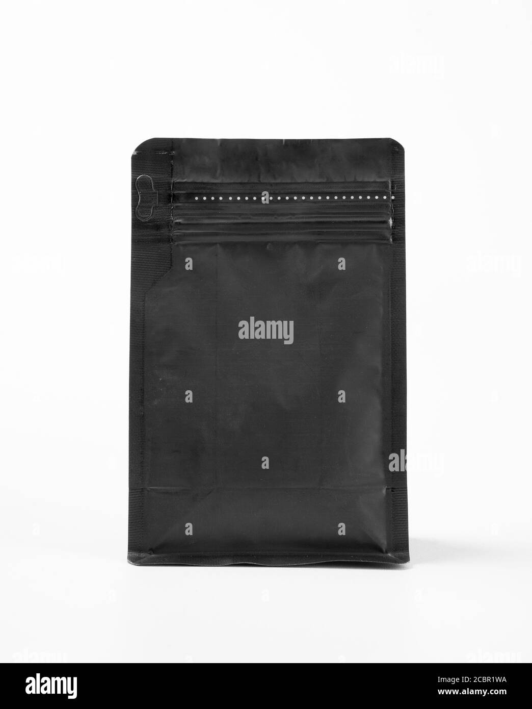 blank black standing pouch container over white background. product ...