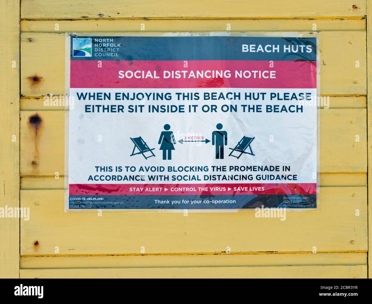 Social distancing notice on beach hut, Sheringham, Norfolk, England ...