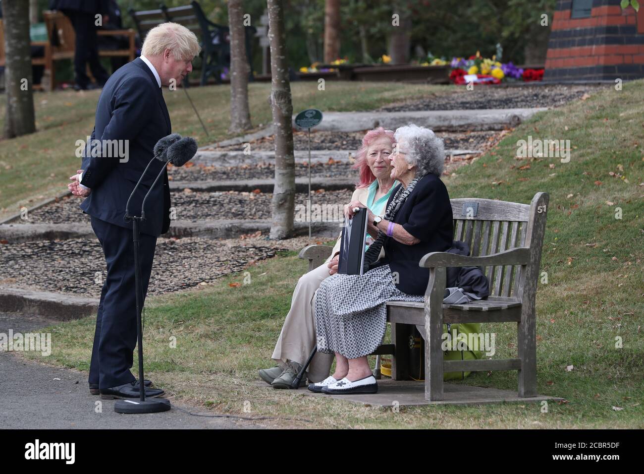Prime Minister Boris Johnson speaks to guests at the national service ...