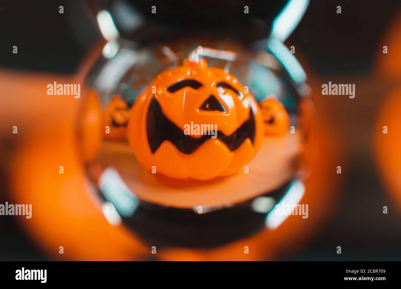Halloween orange pumpkin seen through a crystal ball Stock Photo - Alamy