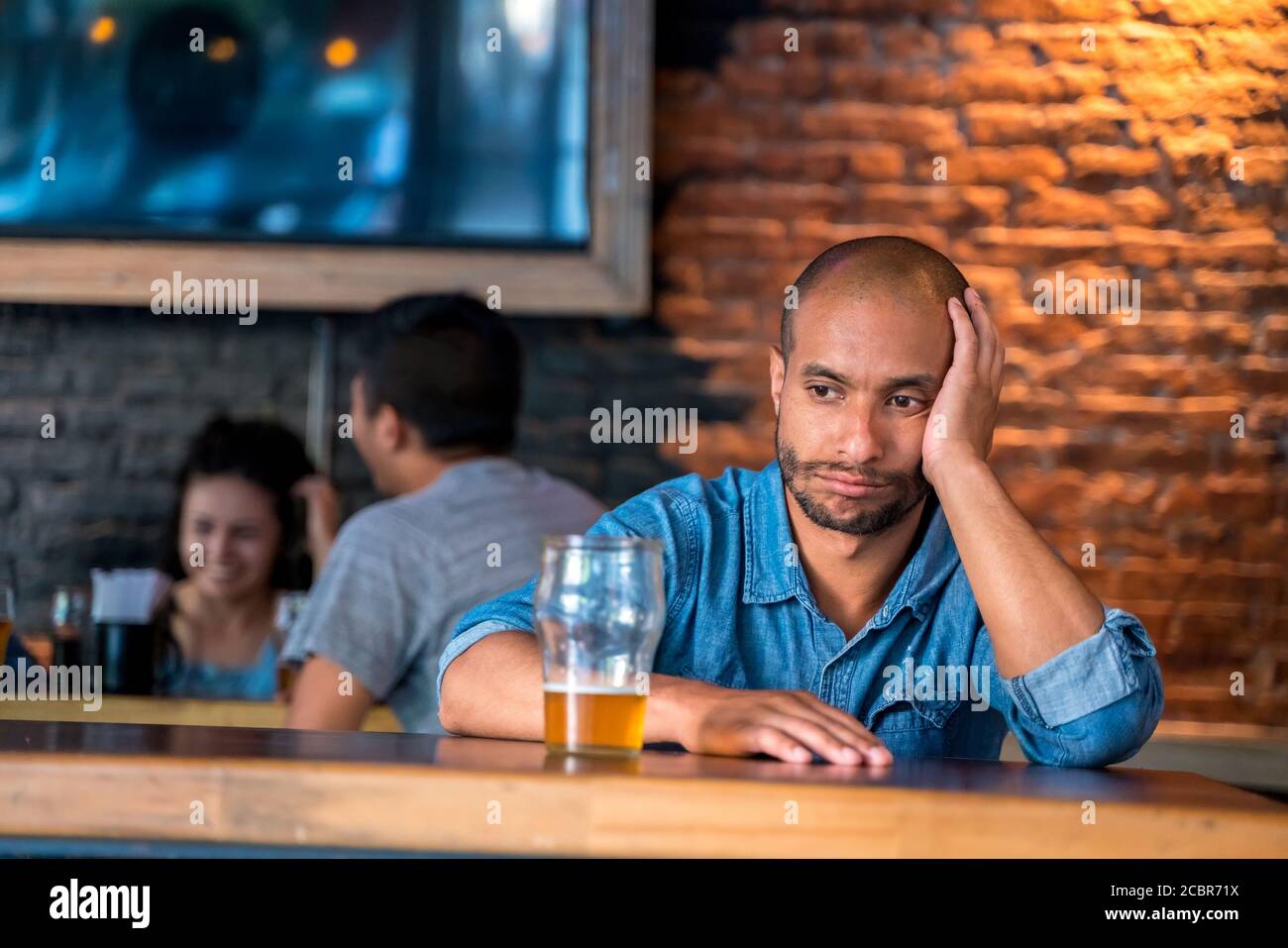Man depressed beer bottle sitting hi-res stock photography and images ...