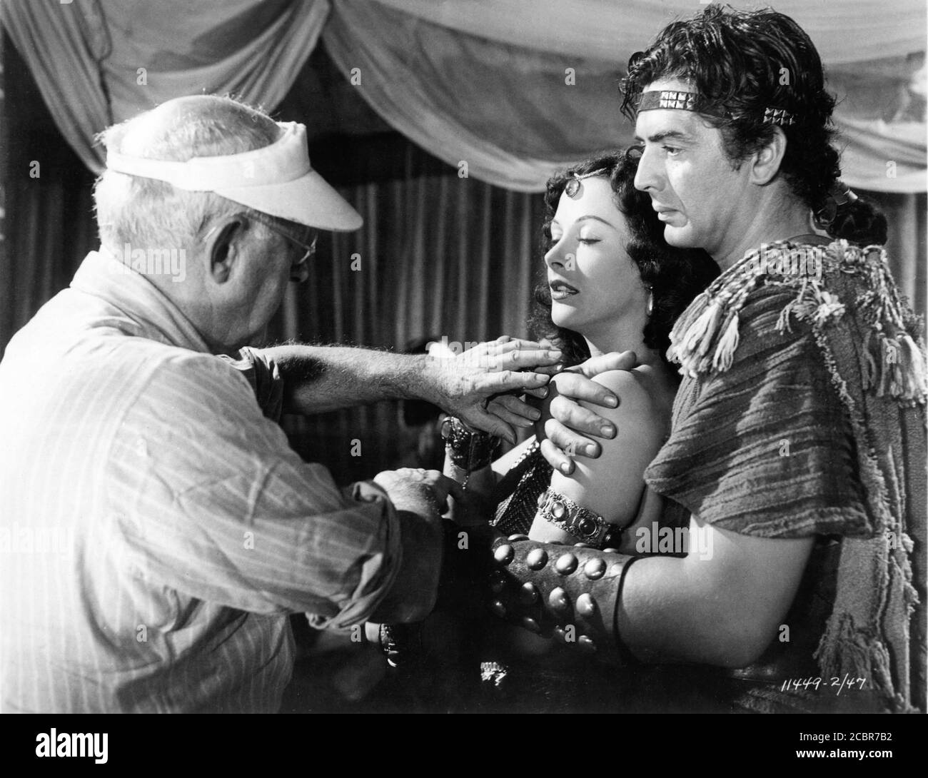CECIL B. DeMILLE on set candid directing HEDY LAMARR and VICTOR MATURE in SAMSON AND DELILAH ...