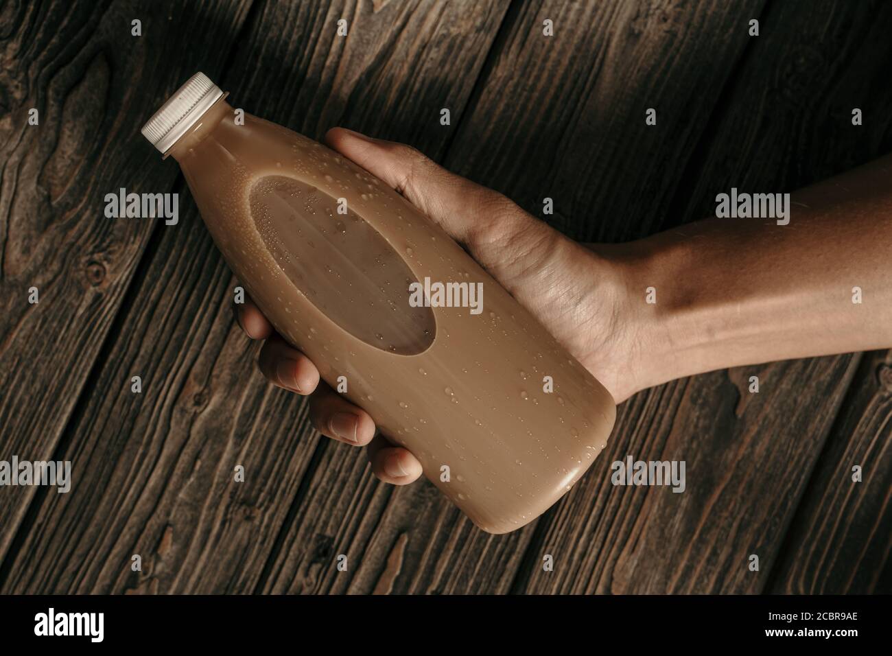 gesture of hand holding plastic bottle product mockup Stock Photo - Alamy
