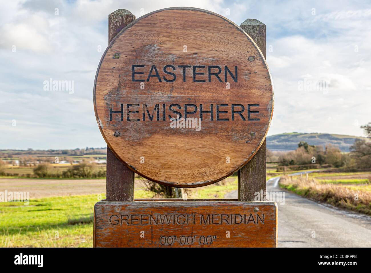 A sign marking the Greenwich Meridian Line in the Sussex countryside ...