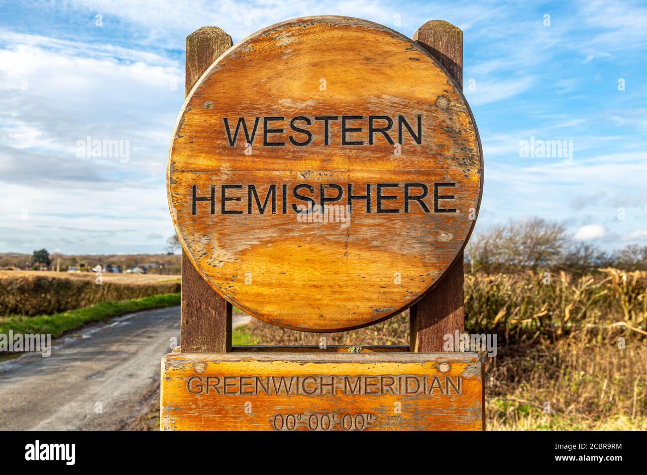 A sign marking the Greenwich Meridian Line in the Sussex countryside ...