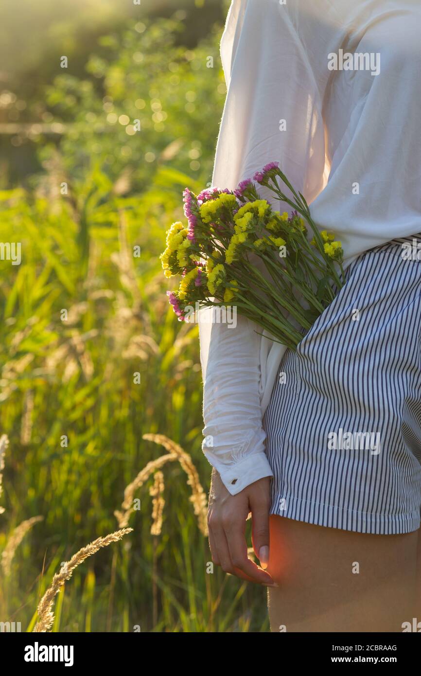 The concept of closeness to nature - flowers in the pocket Stock Photo ...