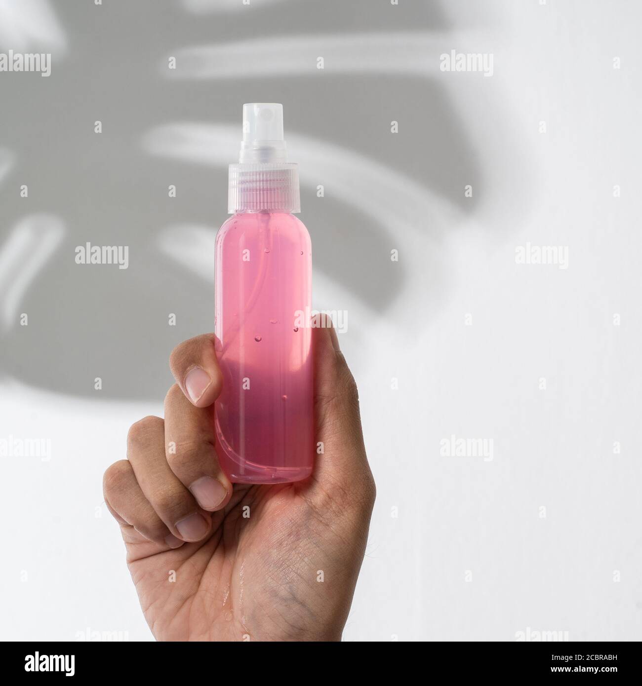 gesture of hand holding plastic bottle product mockup Stock Photo - Alamy