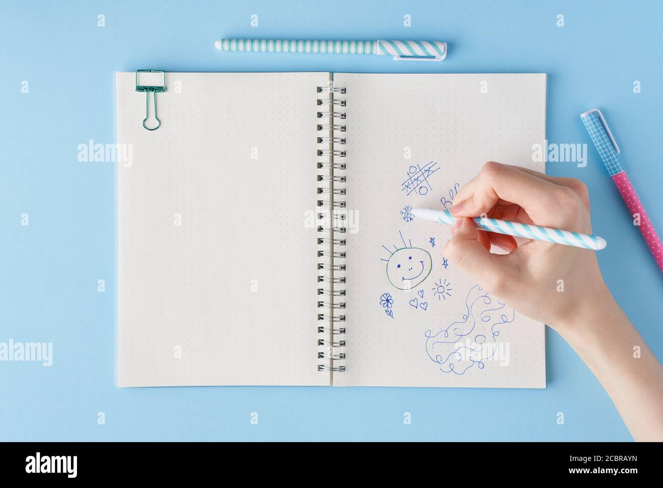 Hand draws scribble in a notebook. Blank notepad page in bullet journal ...