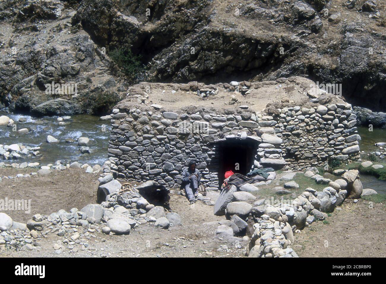 TIBET - RURAL HOUSE BUILT OVER A STREAM TO PROVIDE RUNNING WATER Stock ...