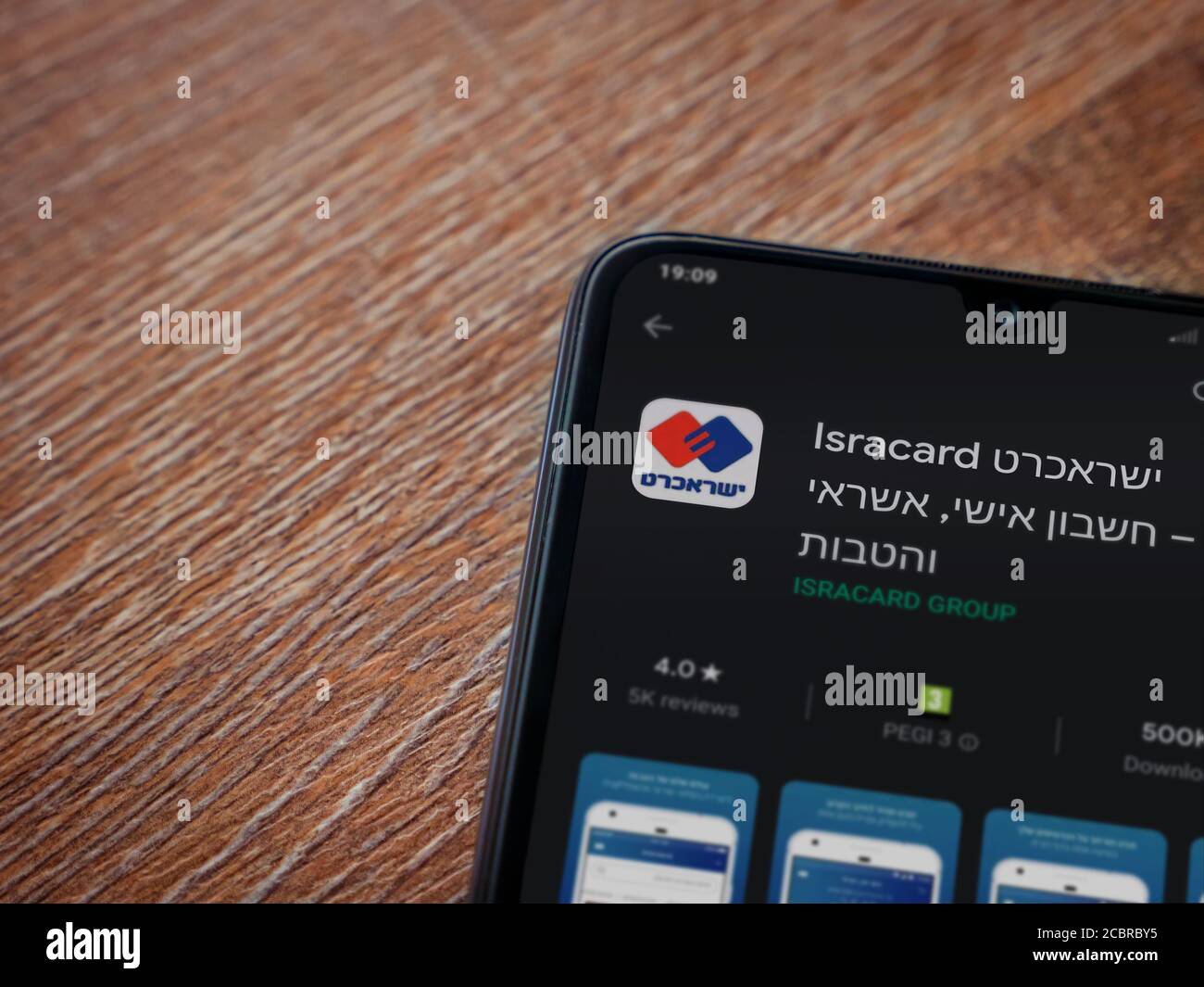 Lod, Israel - July 8, 2020: Isracard app play store page on the display of a black mobile ...