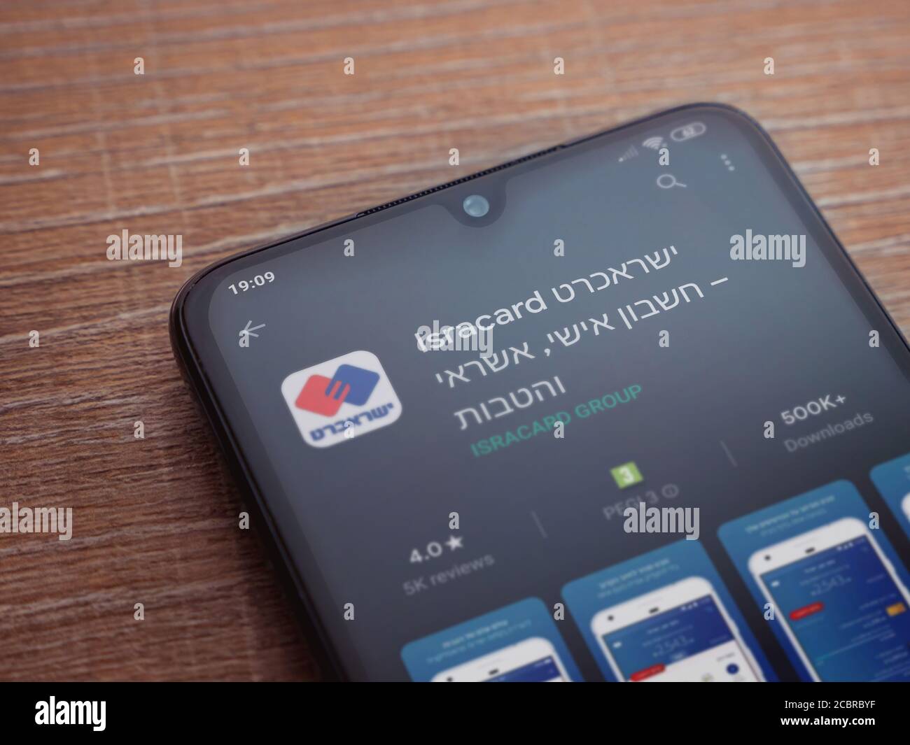 Lod, Israel - July 8, 2020: Isracard app play store page on the display of a black mobile ...