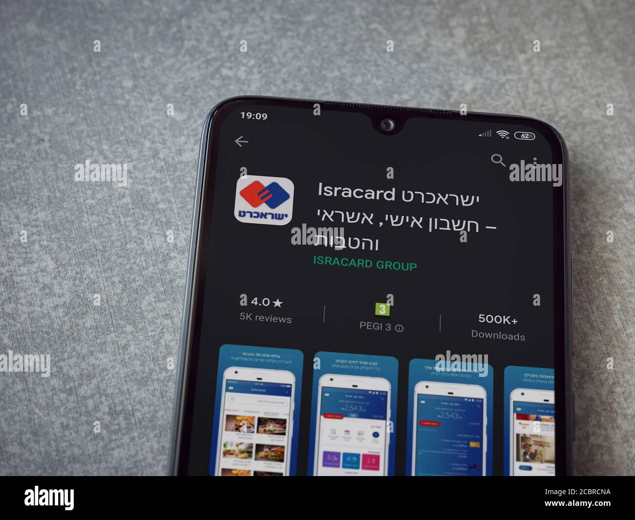 Lod, Israel - July 8, 2020: Isracard app play store page on the display of a black mobile ...