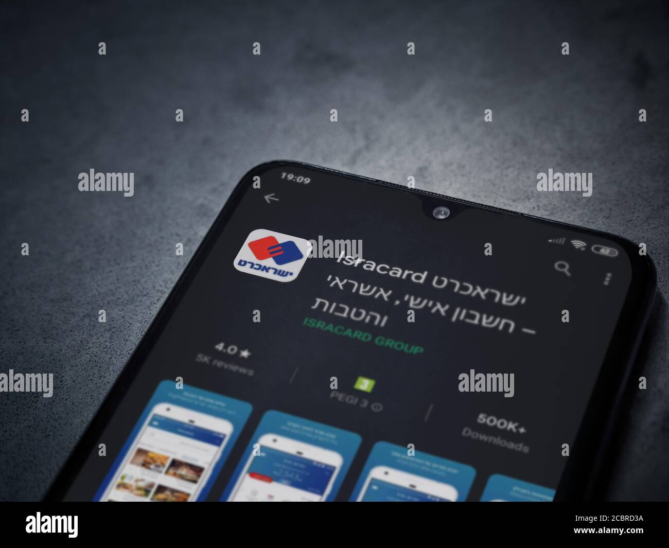 Lod, Israel - July 8, 2020: Isracard app play store page on the display of a black mobile ...