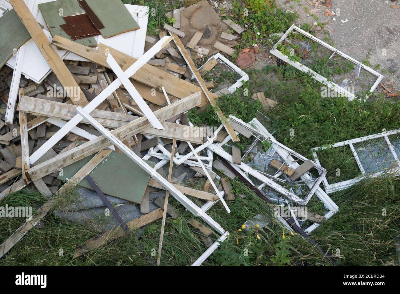 Ruins of collapsed building. Heap and pile with wooden beams, window ...