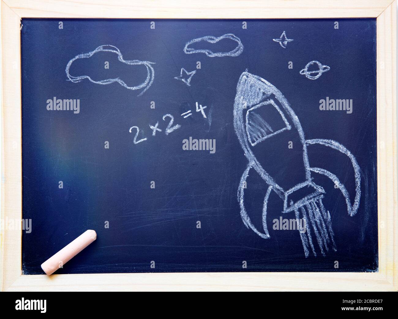 Back to school concept with hand drawn rocket on blackboard Stock Photo ...