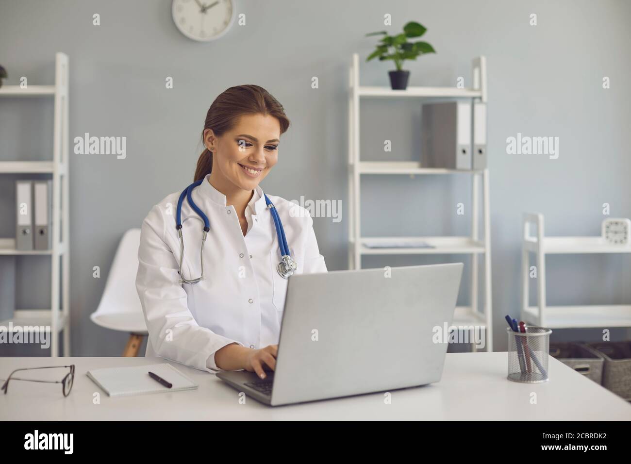 Concept doctor online. Doctor uses computer video camera chat ...