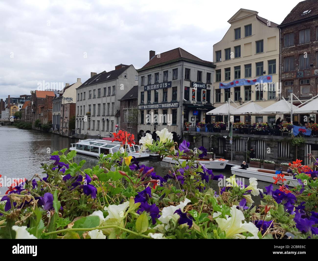 Gent city canal with old beautiful buildings at waterfront. Gent ...