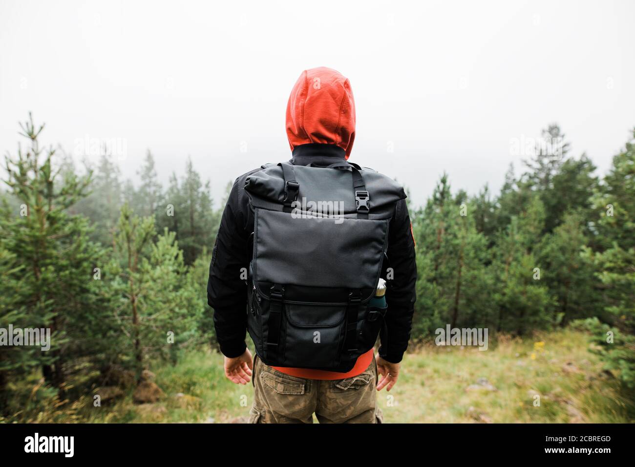 Young male nature explorer in the mountains Stock Photo - Alamy