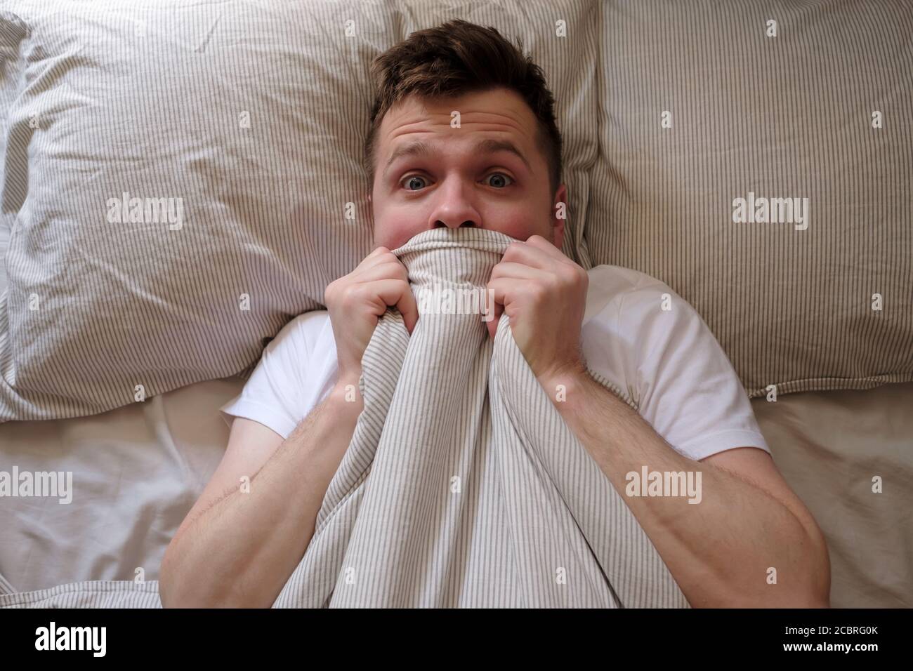 Man hiding under bed hi-res stock photography and images - Alamy