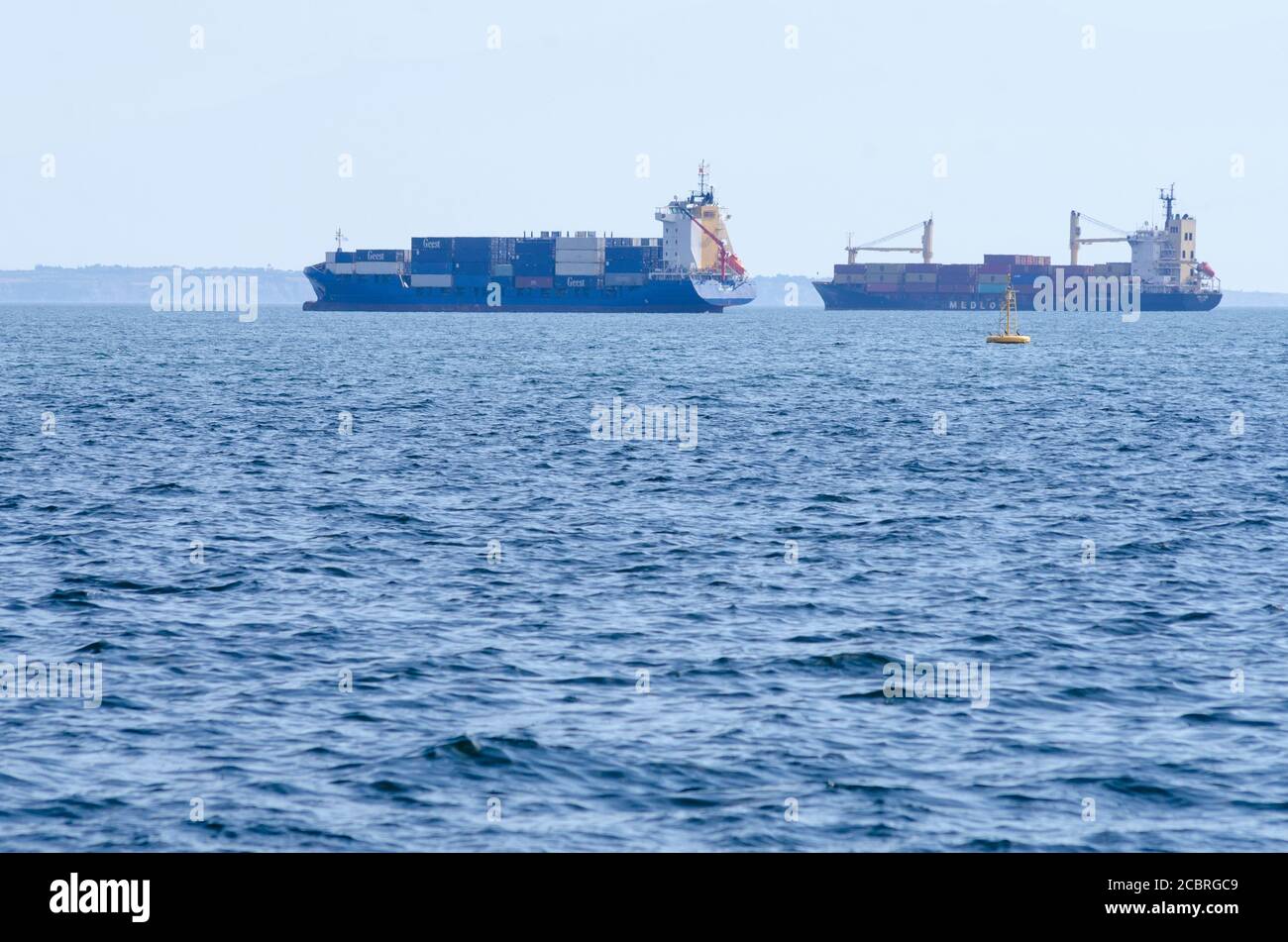 Container ships leaving the Port of Thessaloniki Macedonia Greece ...