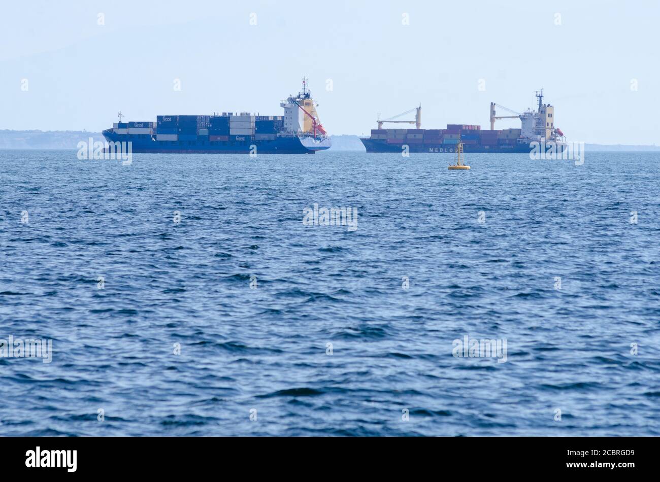 Container ships leaving the Port of Thessaloniki Macedonia Greece ...